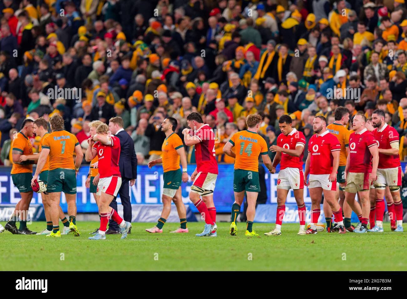 Australian players shake hands with Welsh players after the Men's Rugby ...
