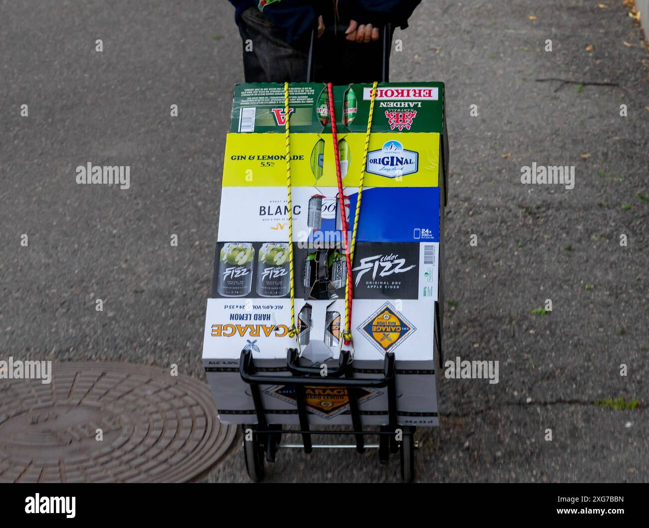 Cruise passenger pulling a 'beer trolley' laden with beverages through ...