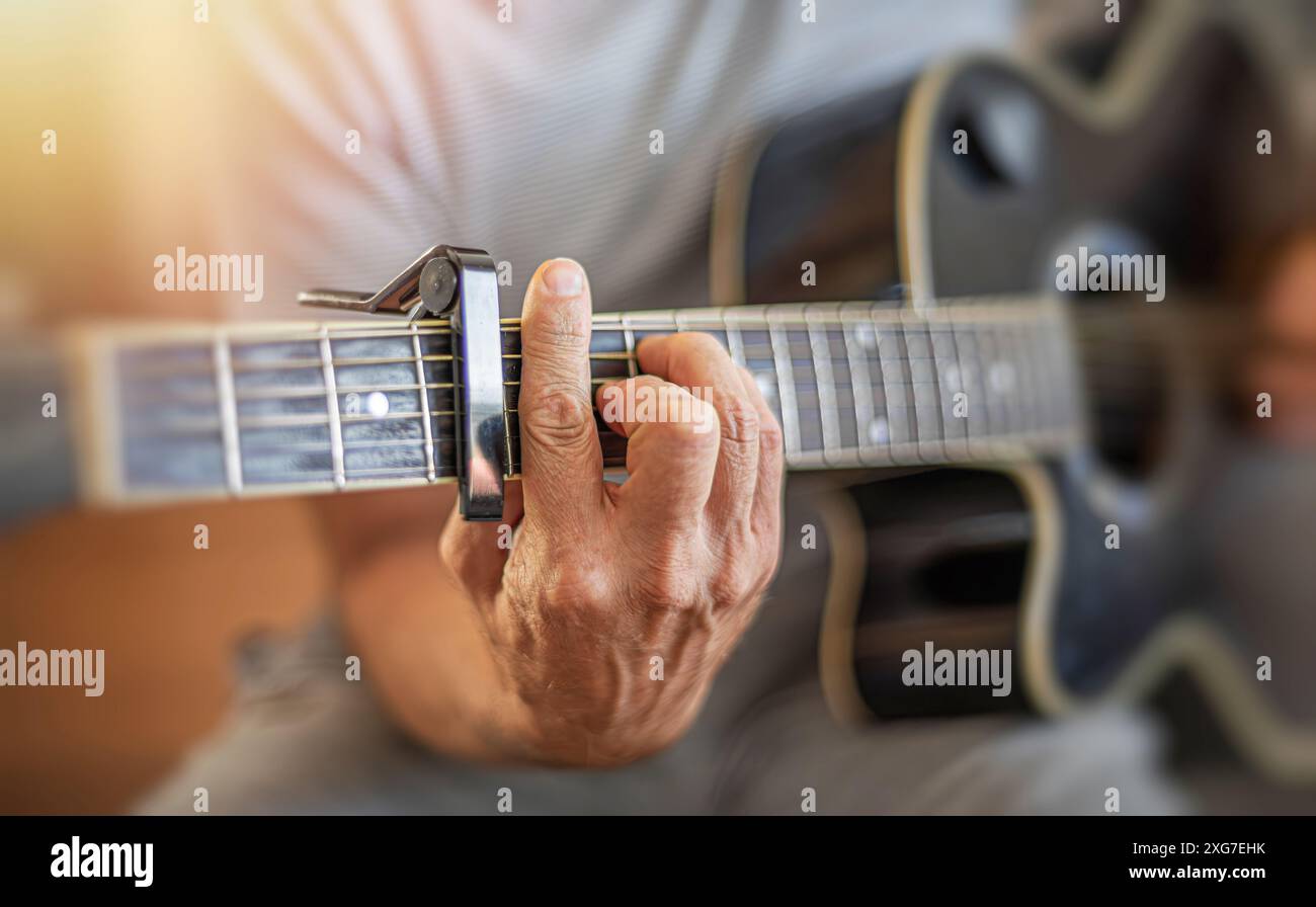 Man plays classical guitar close hi-res stock photography and images ...