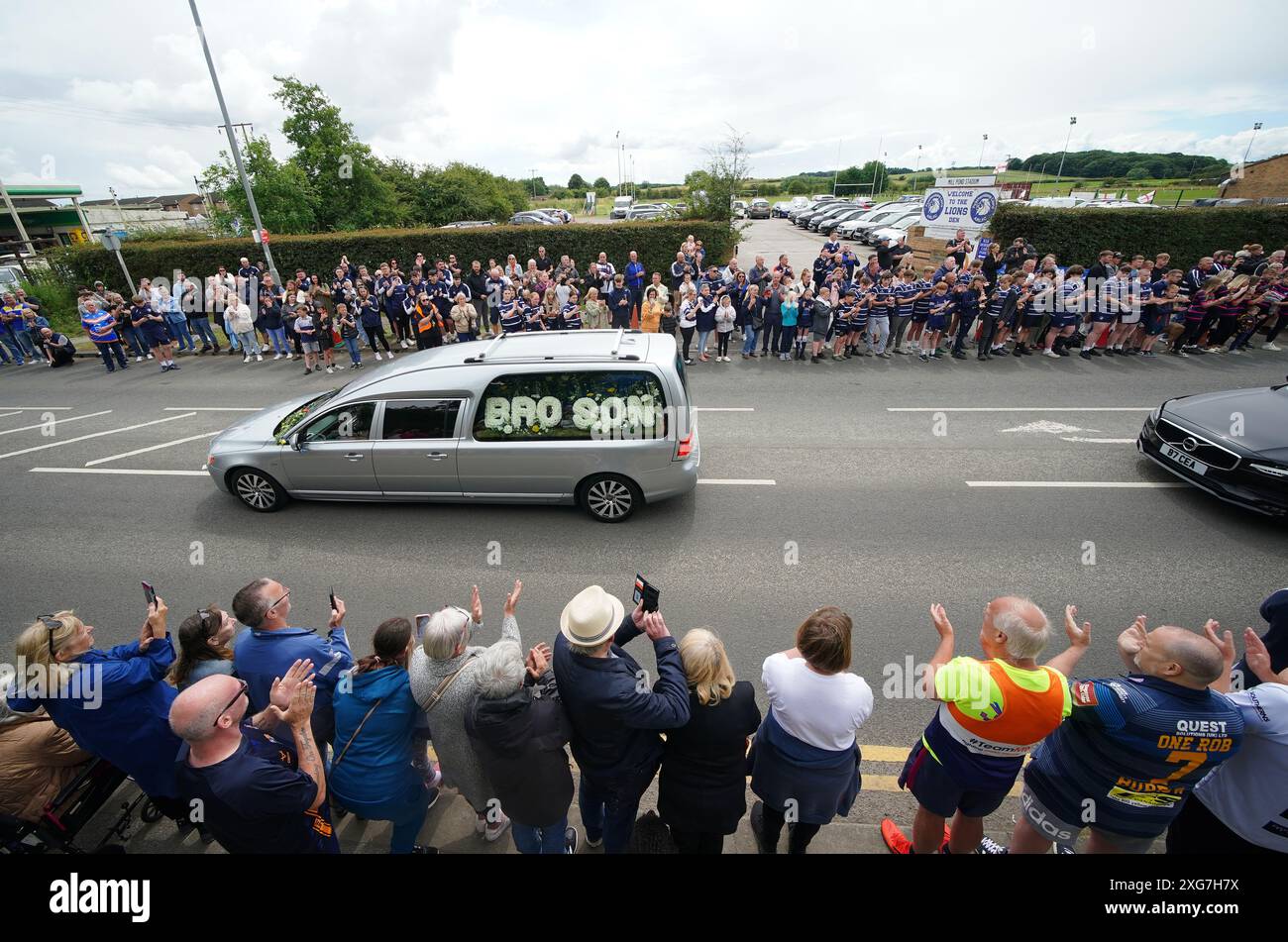 The funeral cortege passes through Featherstone town centre, West ...