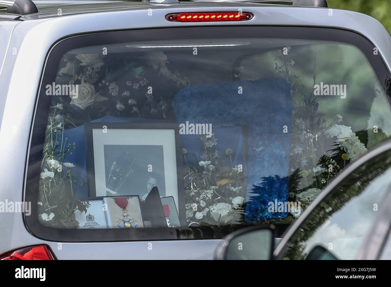 Rob’s CBE medal and a photo in the back window of his funeral car ...