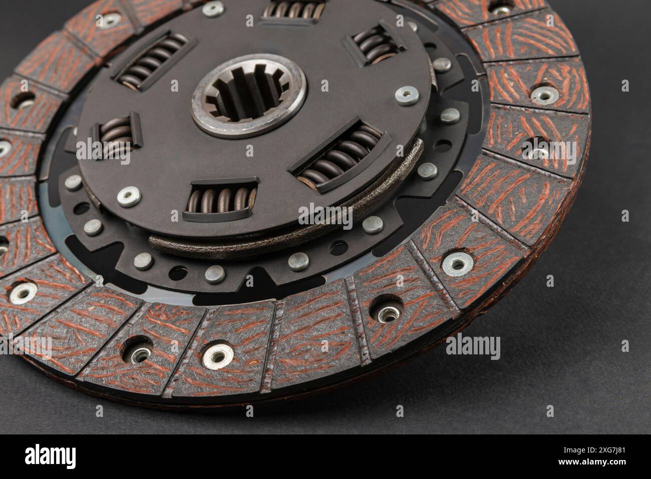 car clutch disc on a black background, auto transmission element, close ...