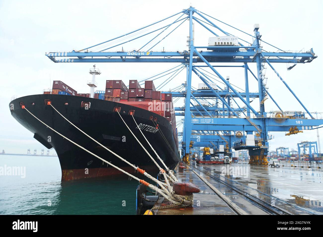 QINGDAO, CHINA - JULY 7, 2024 - Cargo ships load and unload foreign ...