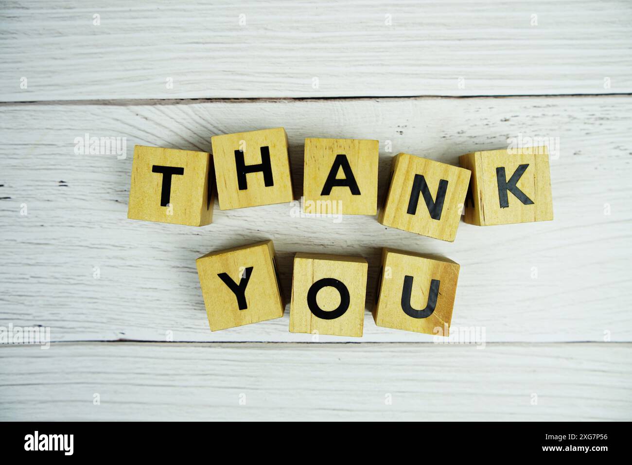 Thank you alphabet letters with wooden block top view on wooden ...