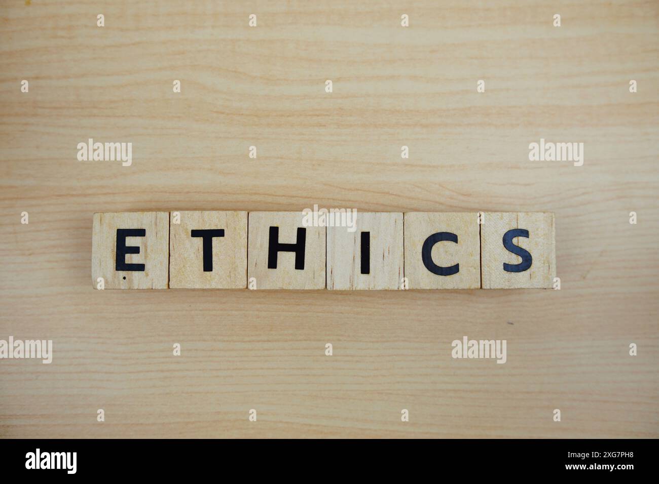 ETHICS alphabet letters top view on wooden background Stock Photo - Alamy