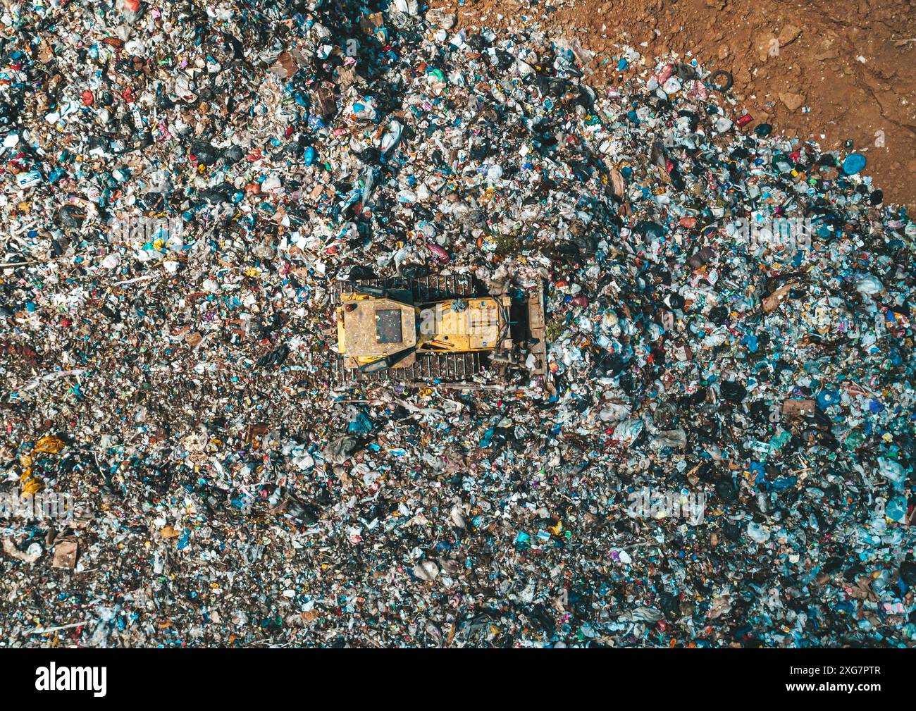 Aerial top down view of bulldozer working in a large landfill Stock ...