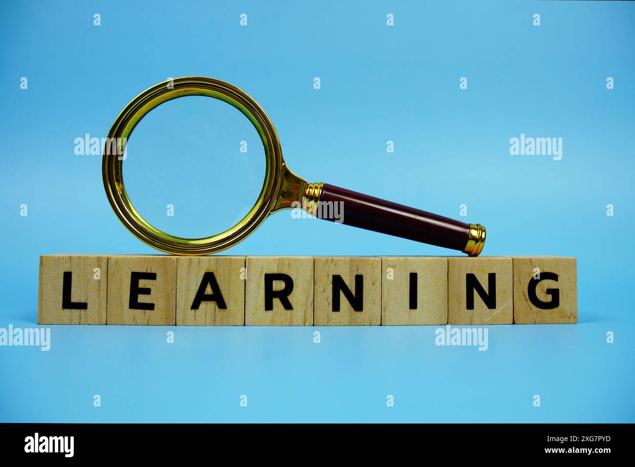 Learning with wooden blocks alphabet letters and Magnifying glass on ...