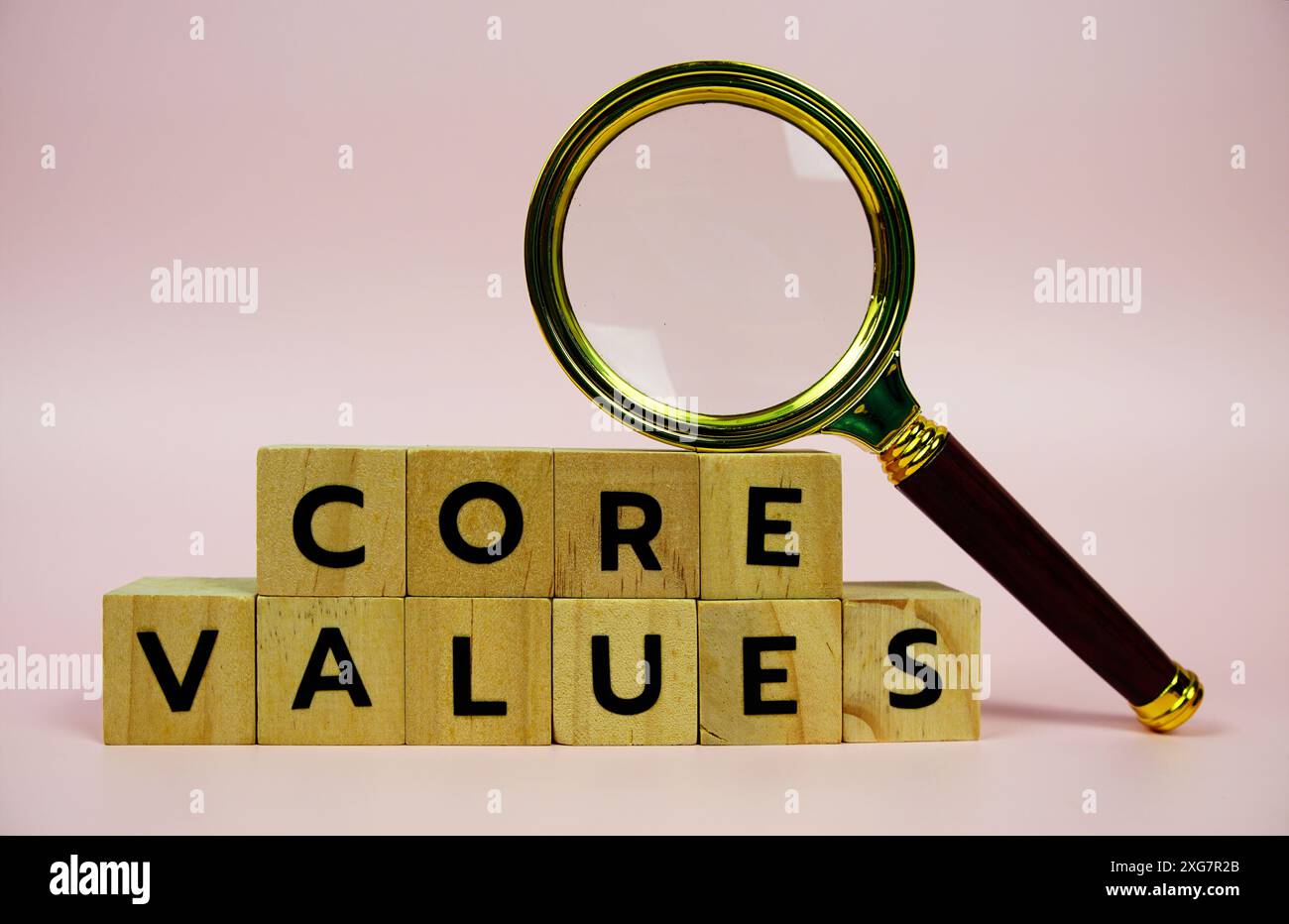 Core Values with wooden blocks alphabet letters and Magnifying glass on ...