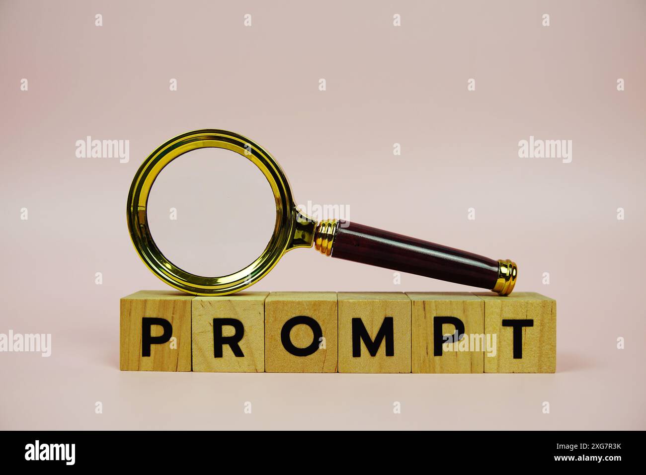 Prompt with wooden blocks alphabet letters and Magnifying glass on pink ...