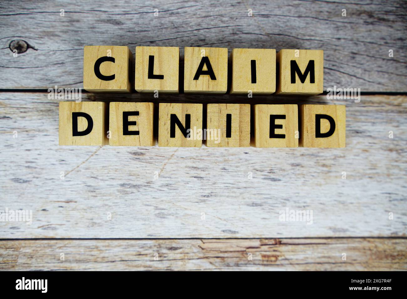Claim Denied with wooden blocks alphabet letters on wooden background ... Claim Denied with wooden blocks alphabet letters on wooden background ...