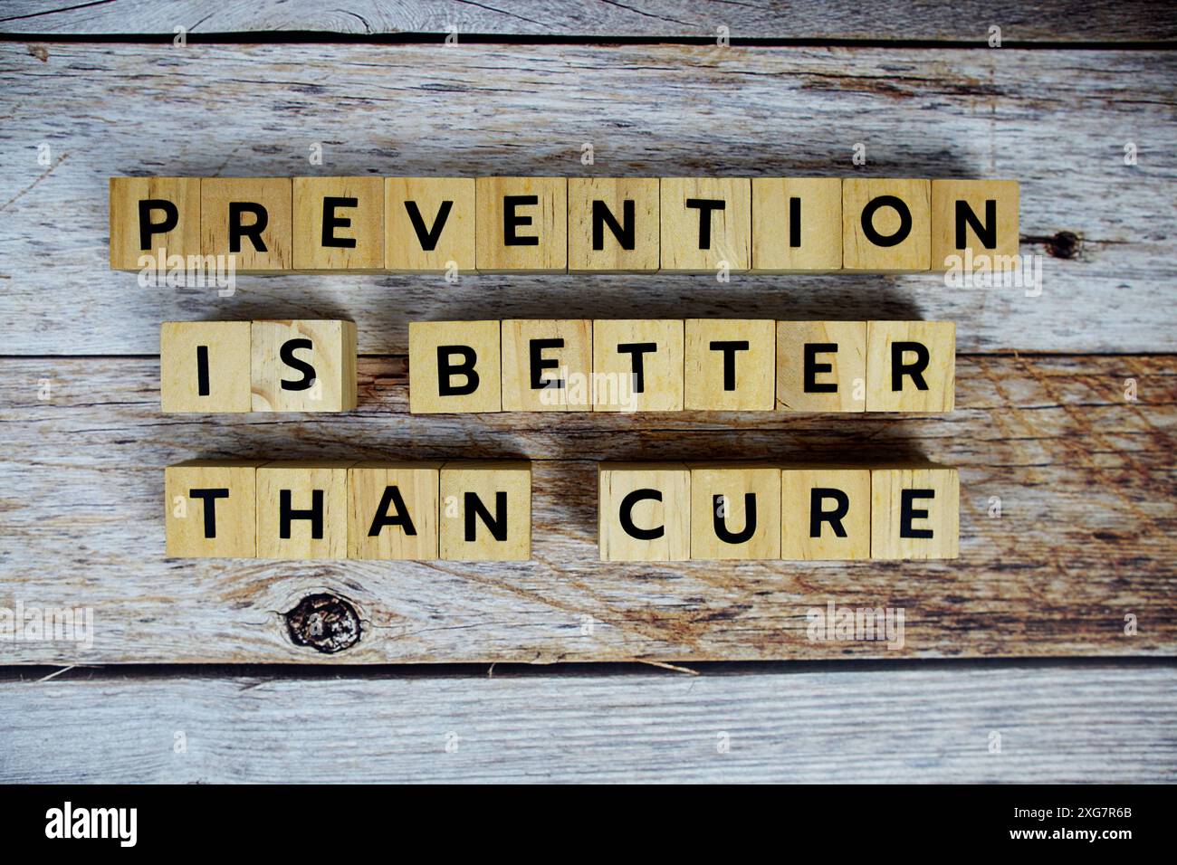 Prevention is better than cure with wooden blocks alphabet letterstop ...