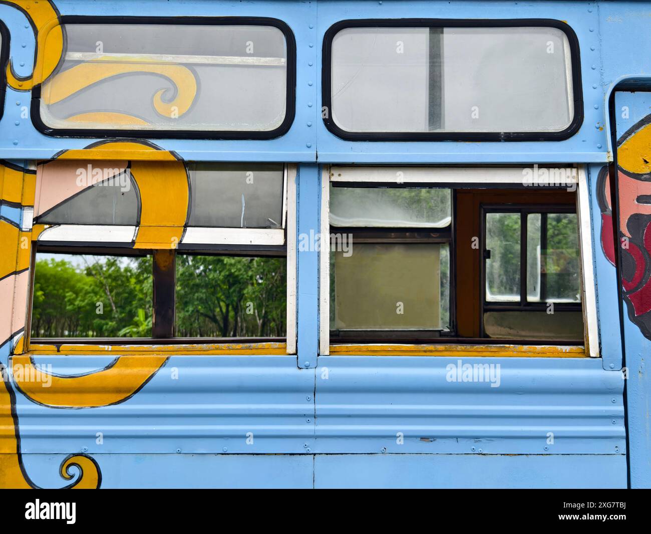 A blue bus with a cartoon character painted on its surface Stock Photo ...