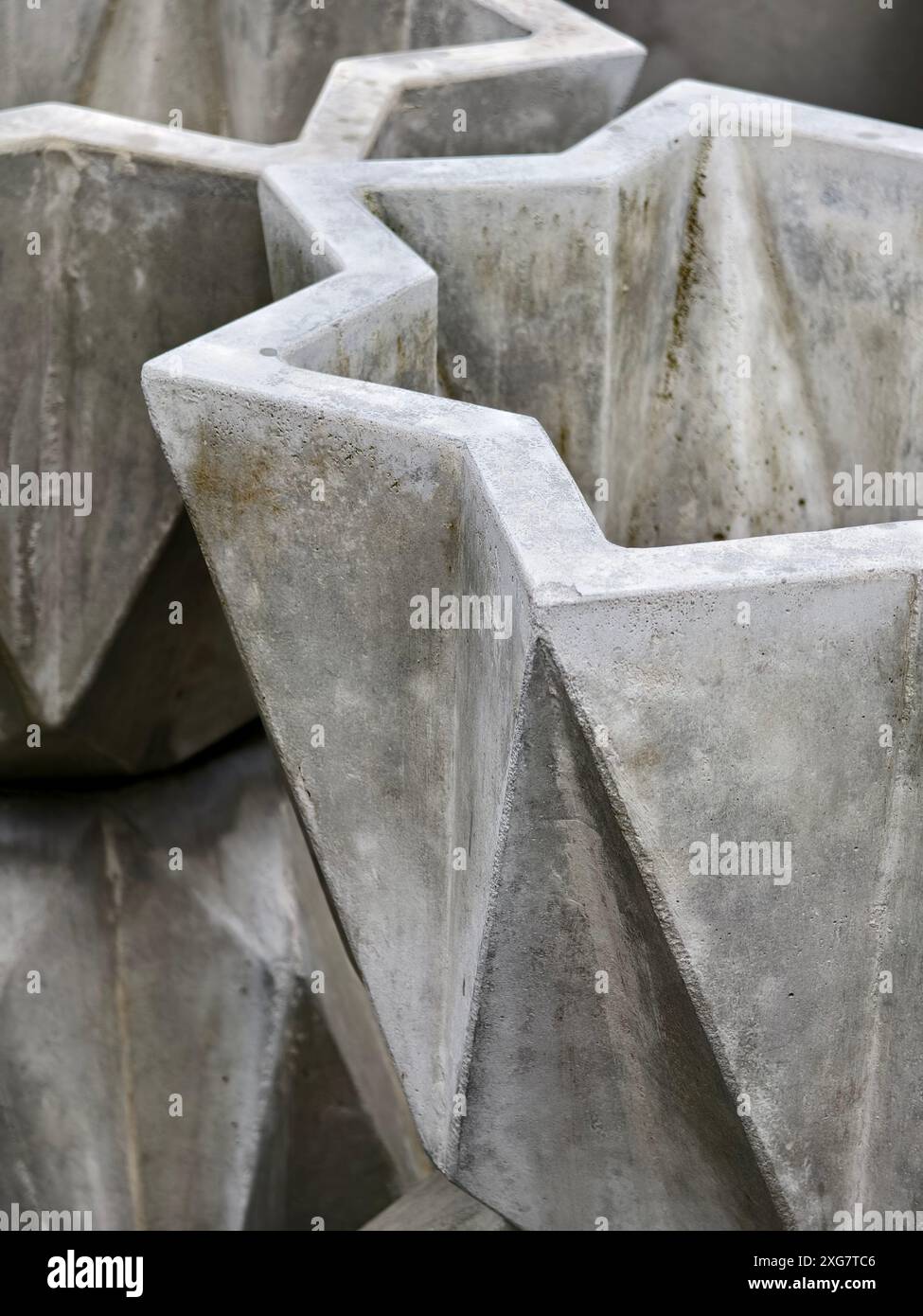 Several concrete plant pots are stacked on top of each other Stock ...