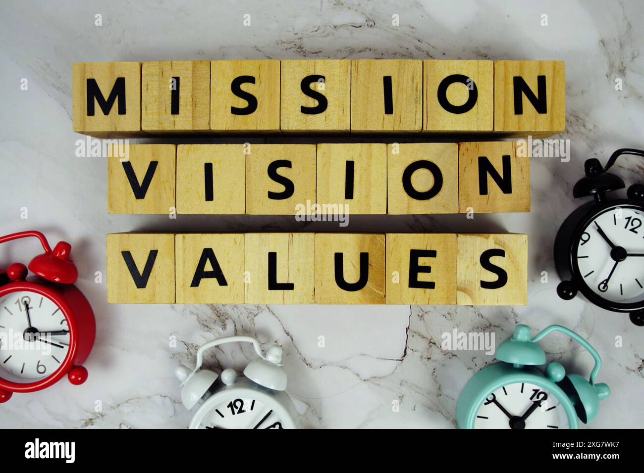 Mission Vision Values with wooden blocks alphabet letters and alarm ...