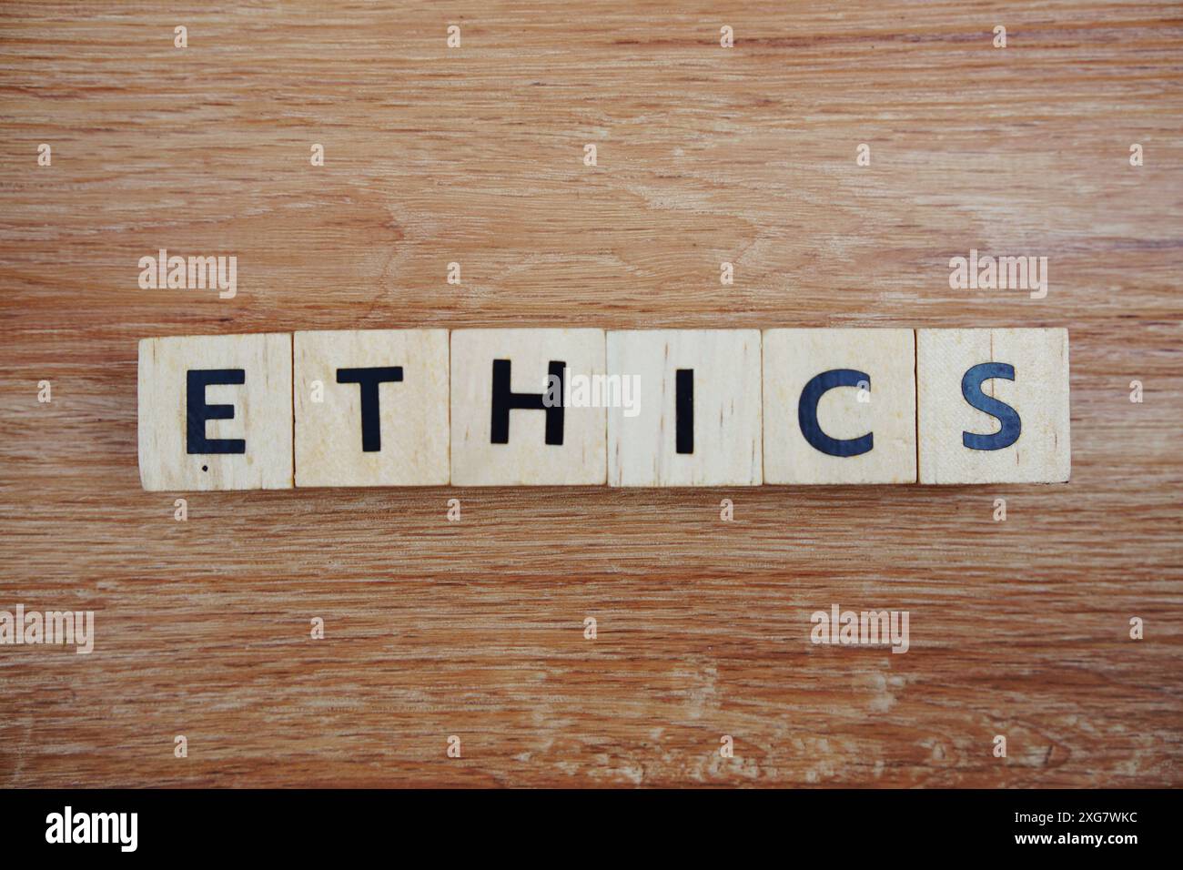 ETHICS alphabet letters top view on wooden background Stock Photo - Alamy