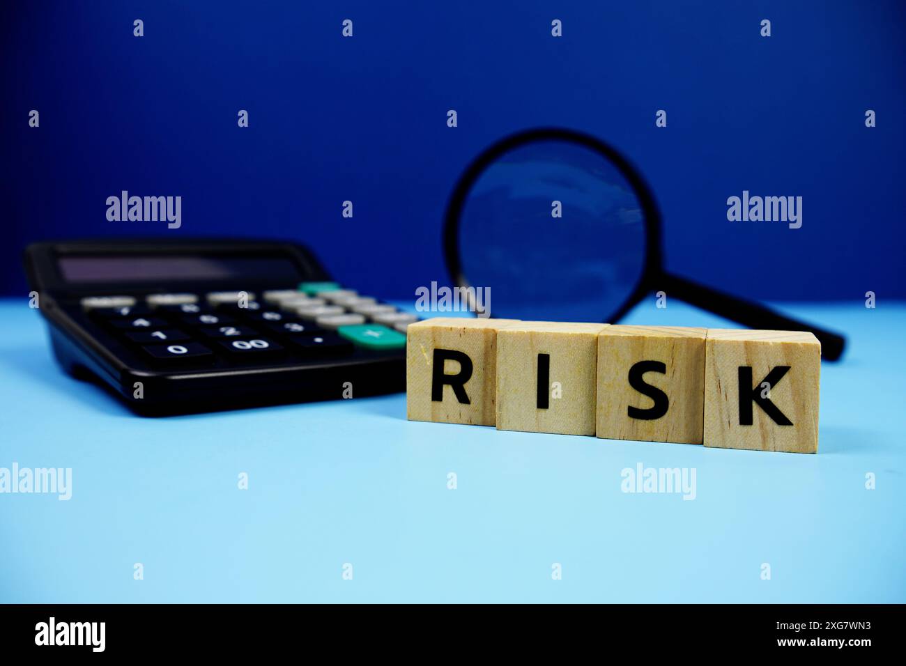 Risk with wooden blocks alphabet letters and Magnifying glass and ...