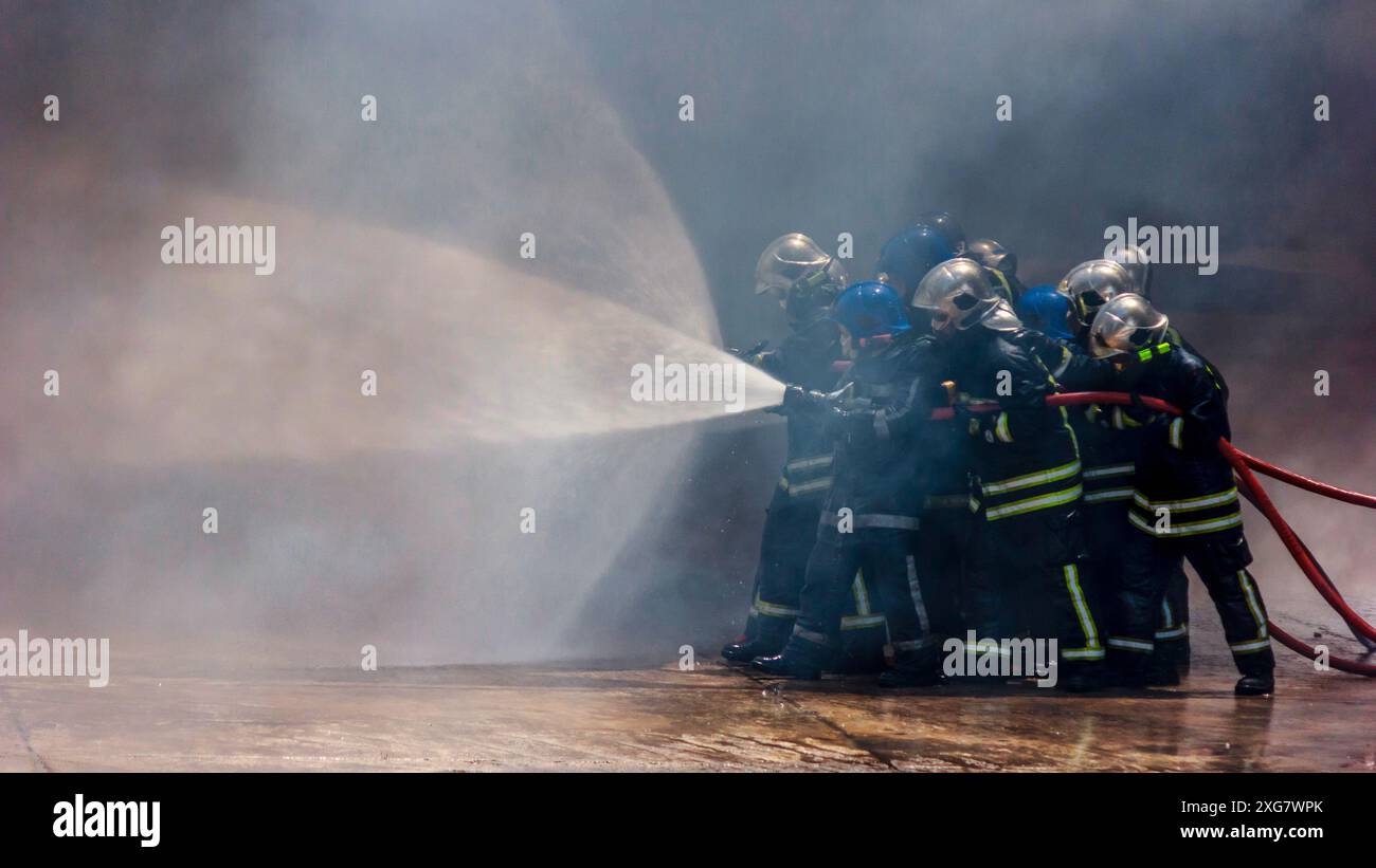 firefighters in action Stock Photo - Alamy
