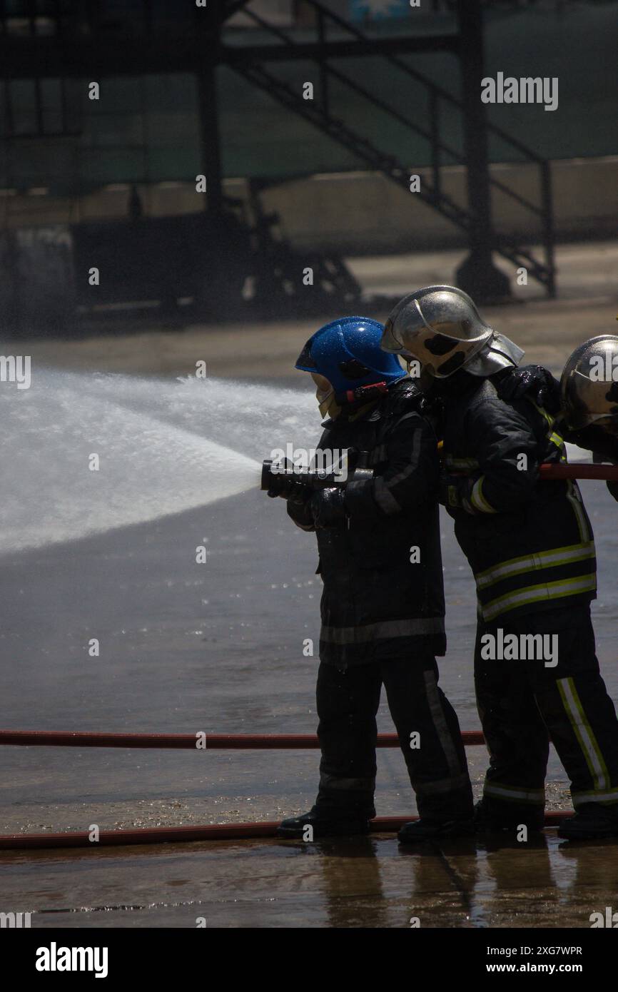 firefighters in action Stock Photo - Alamy