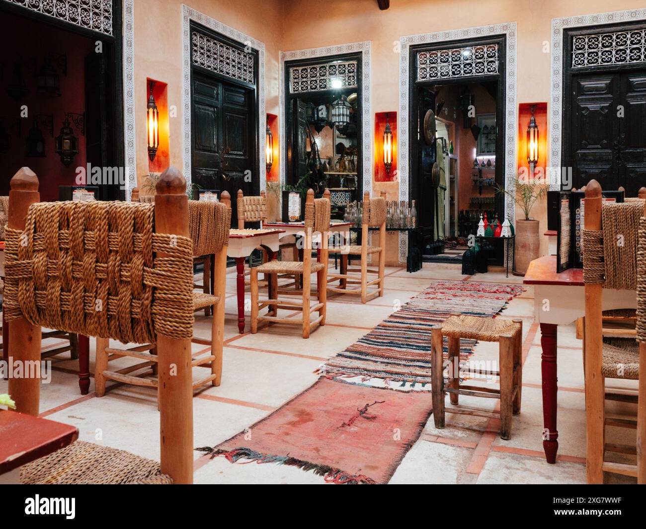 Cozy traditional restaurant with rustic wooden furniture, woven chairs ...