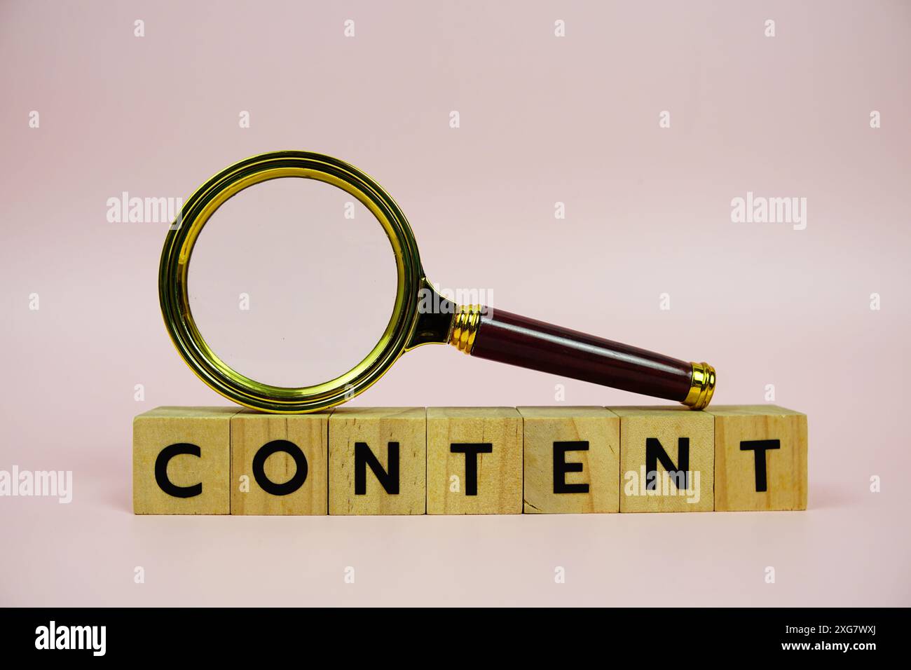 Content with wooden blocks alphabet letters and Magnifying glass on ...