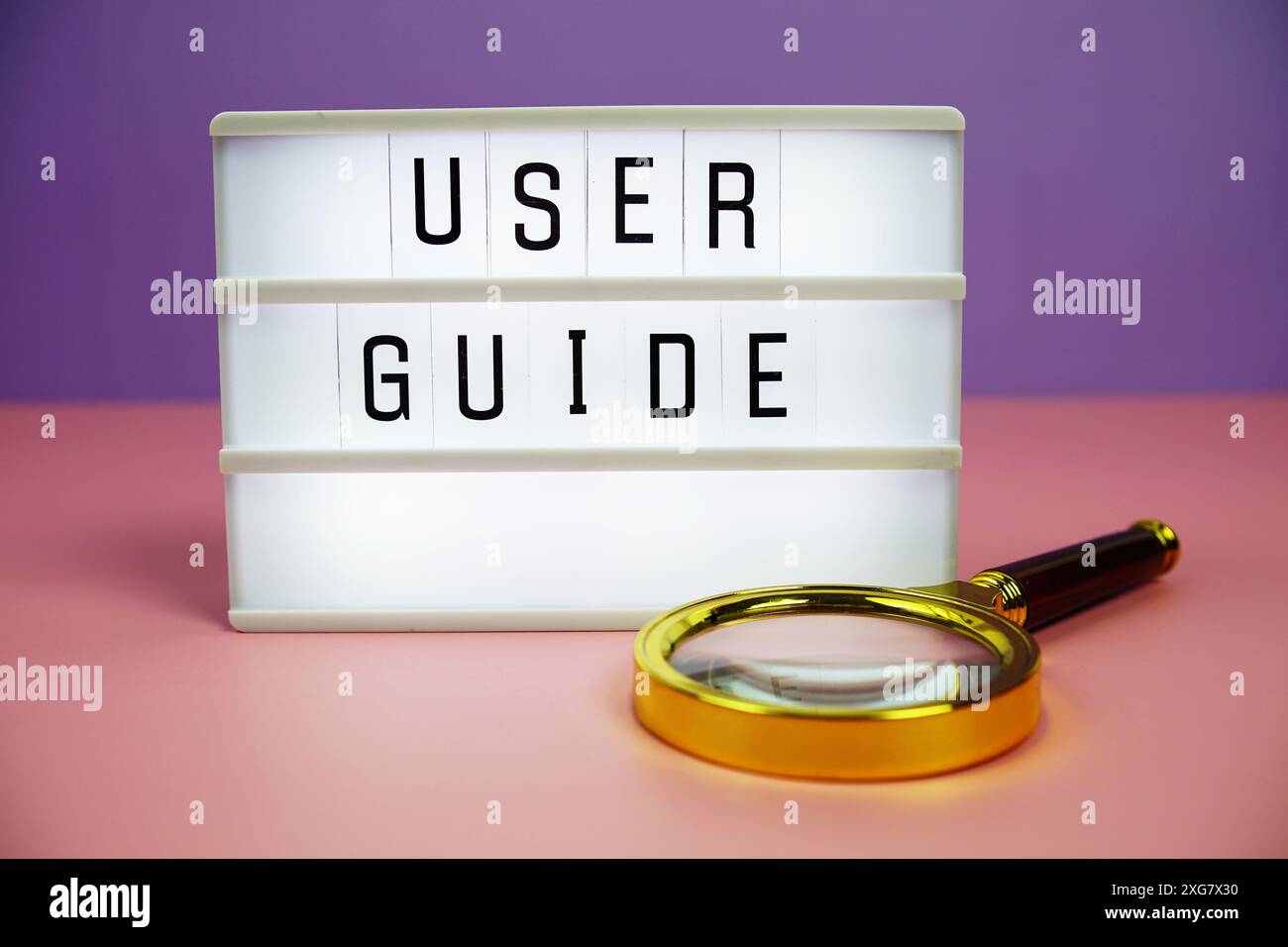 User Guide letterboard text on LED Lightbox and magnifying glass on ...