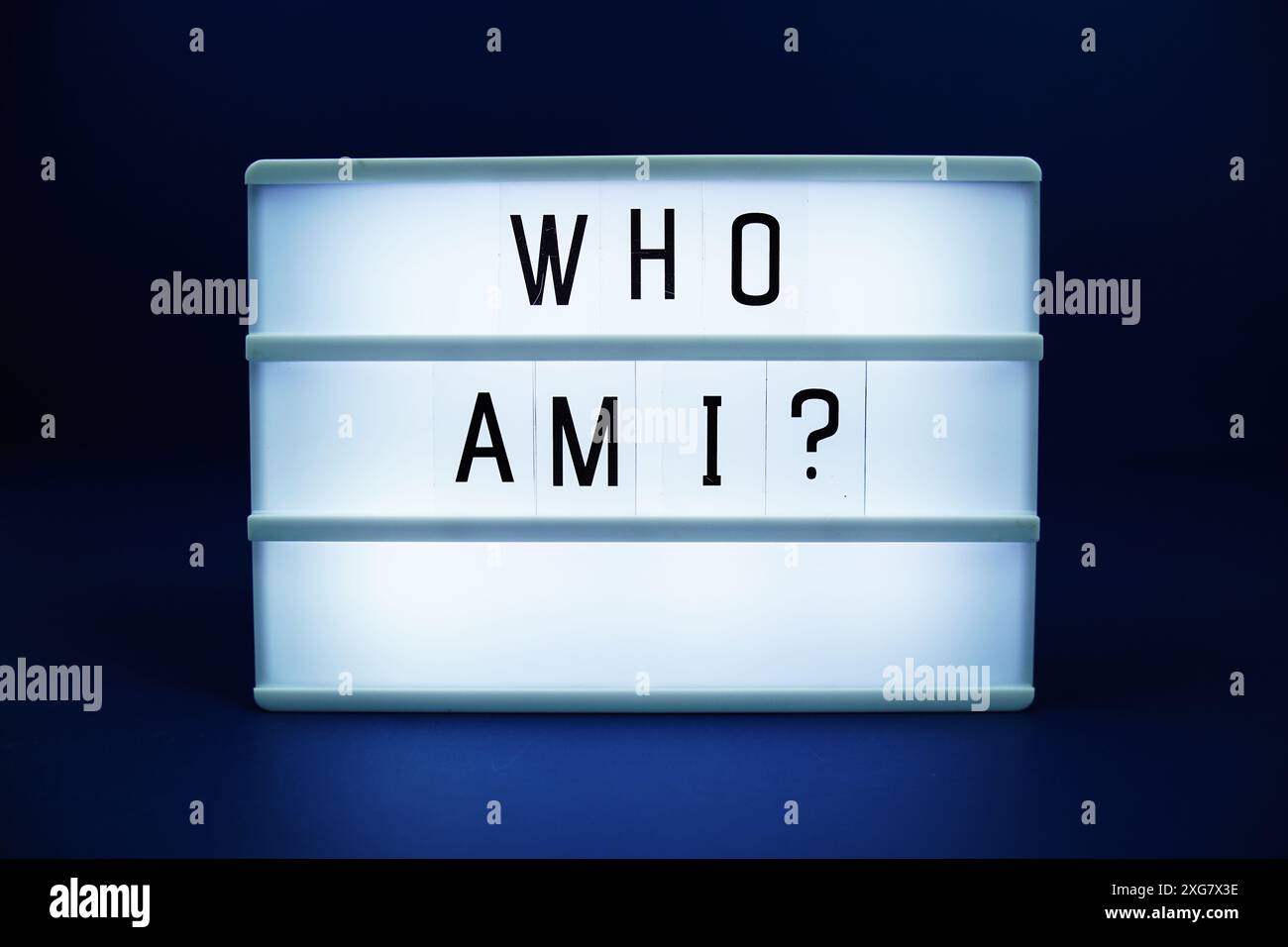 Who am I letterboard text on LED Lightbox on blue background Stock ...