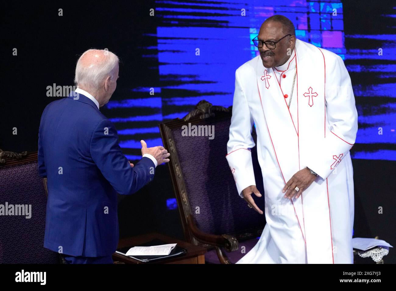 President Joe Biden, left, walks to greet Bishop Ernest C. Morris, Sr ...