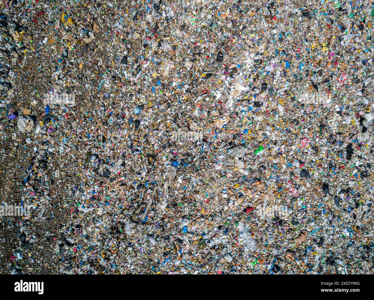 Aerial top down view of a landfill filled with waste in the daytime ...