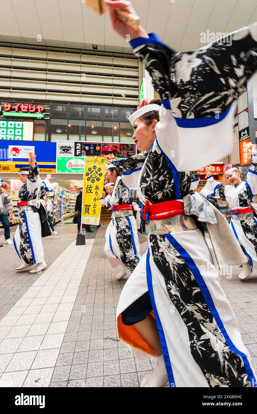 Close up wide angle, Japanese women dancers dancing in formation in a ...