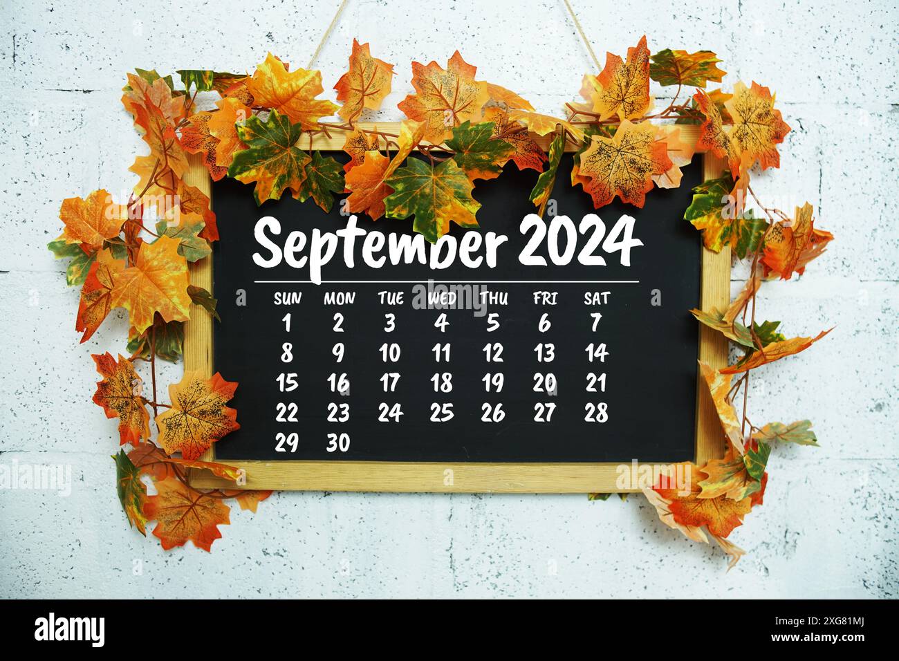 September 2024 monthly calendar with maple leaf decoration Stock Photo ...