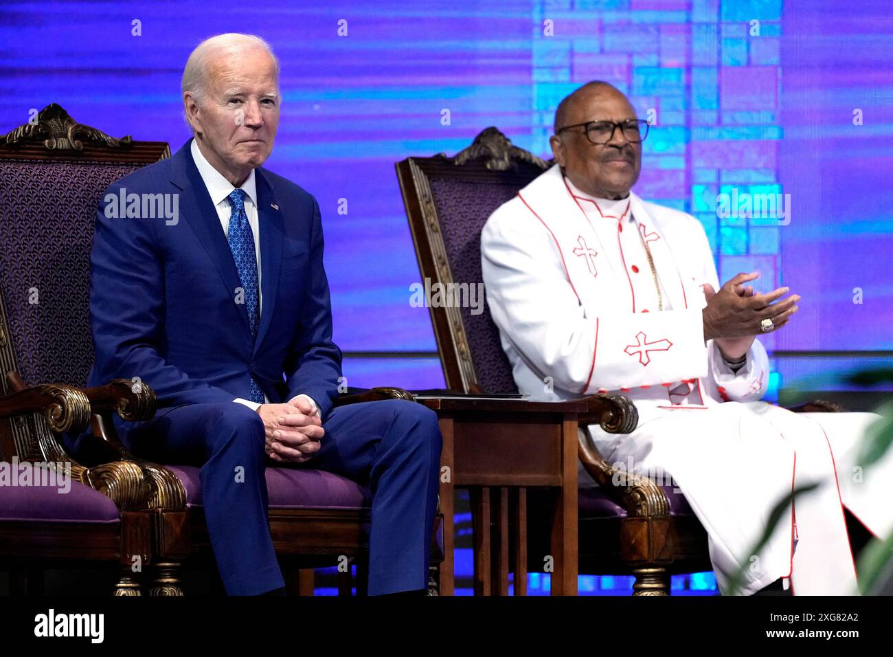 President Joe Biden, left, and Bishop Ernest C. Morris, Sr., sit during ...