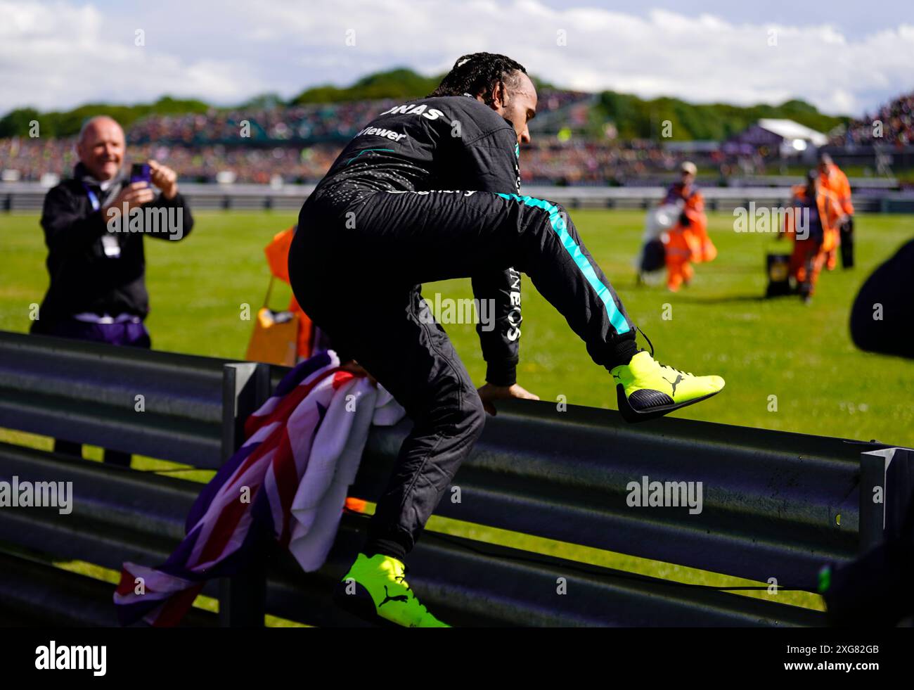 Mercedes driver Lewis Hamilton celebrates after winning the British ...