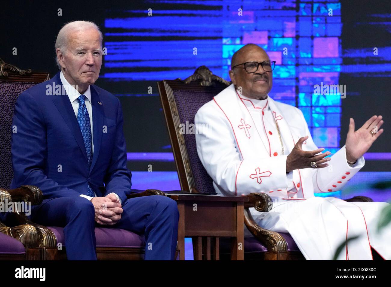 President Joe Biden, left, and Bishop Ernest C. Morris, Sr., sit during ...