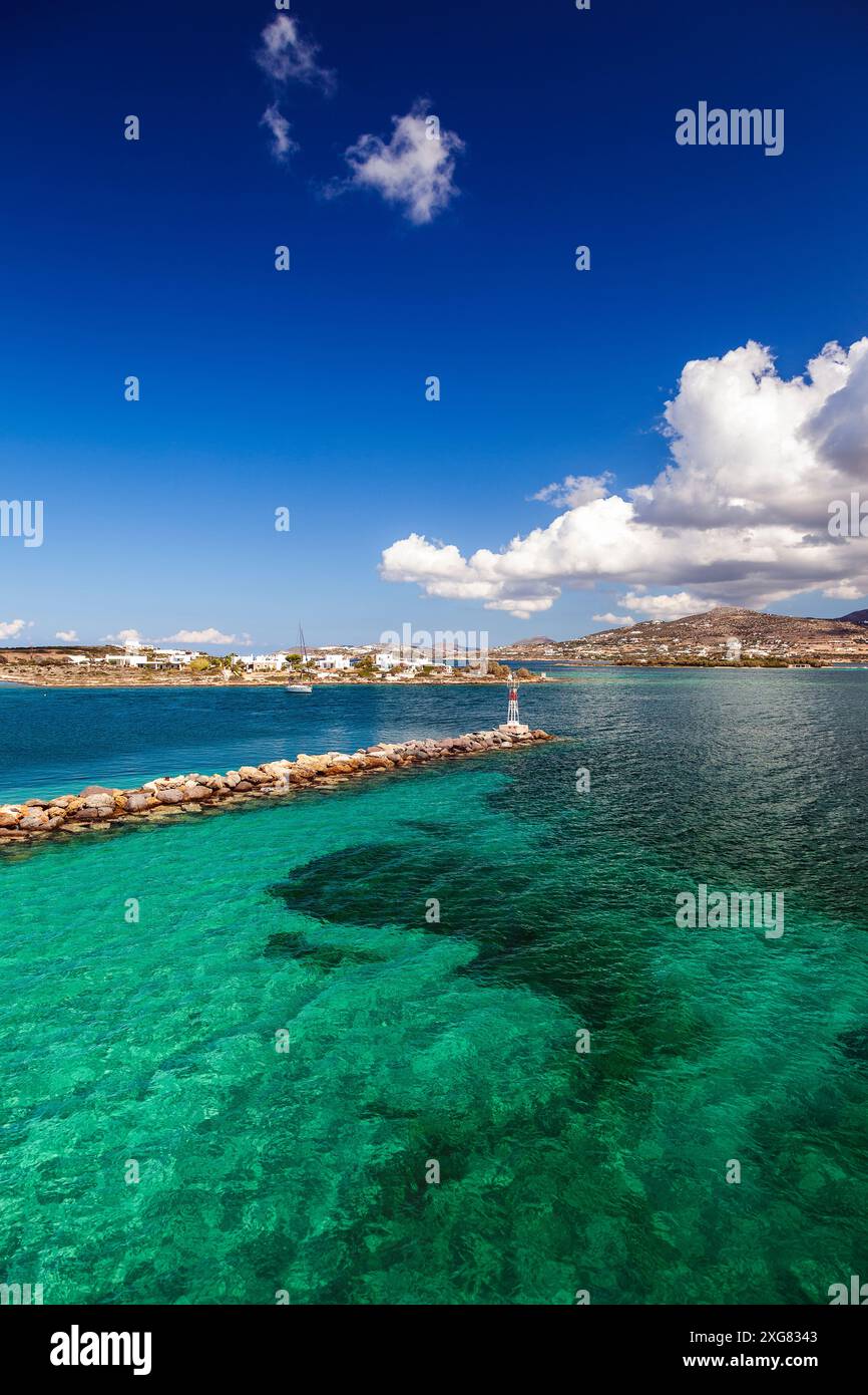 Beautiful azure waters and glorious white clouds at Antiparos port, in ...