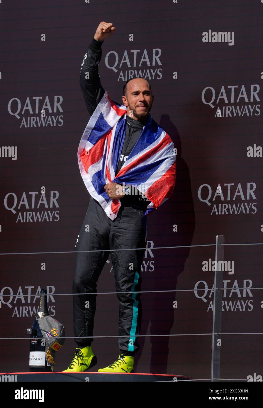 Mercedes driver Lewis Hamilton celebrates on the Podium after winning ...