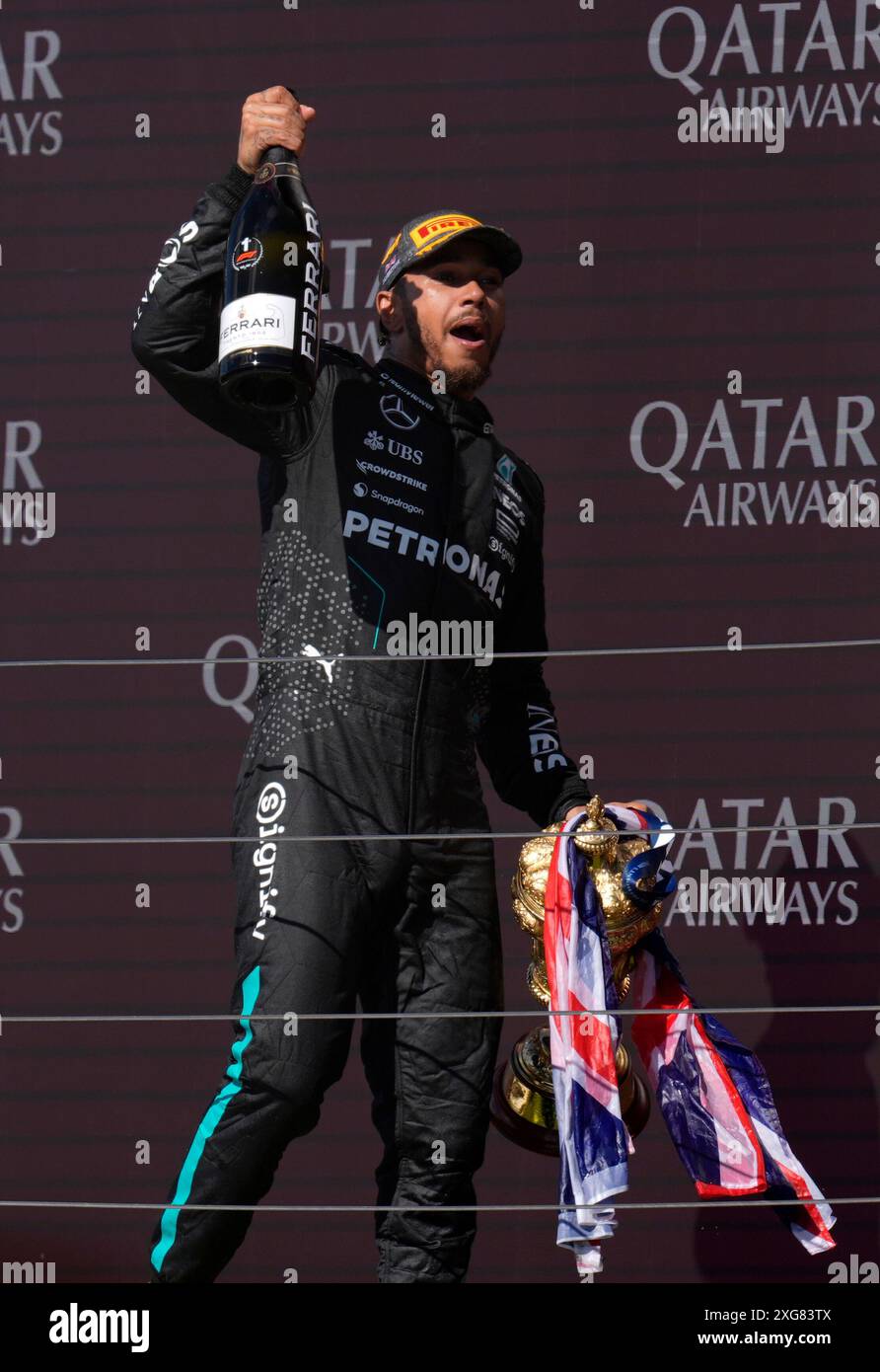Mercedes driver Lewis Hamilton celebrates on the Podium after winning ...