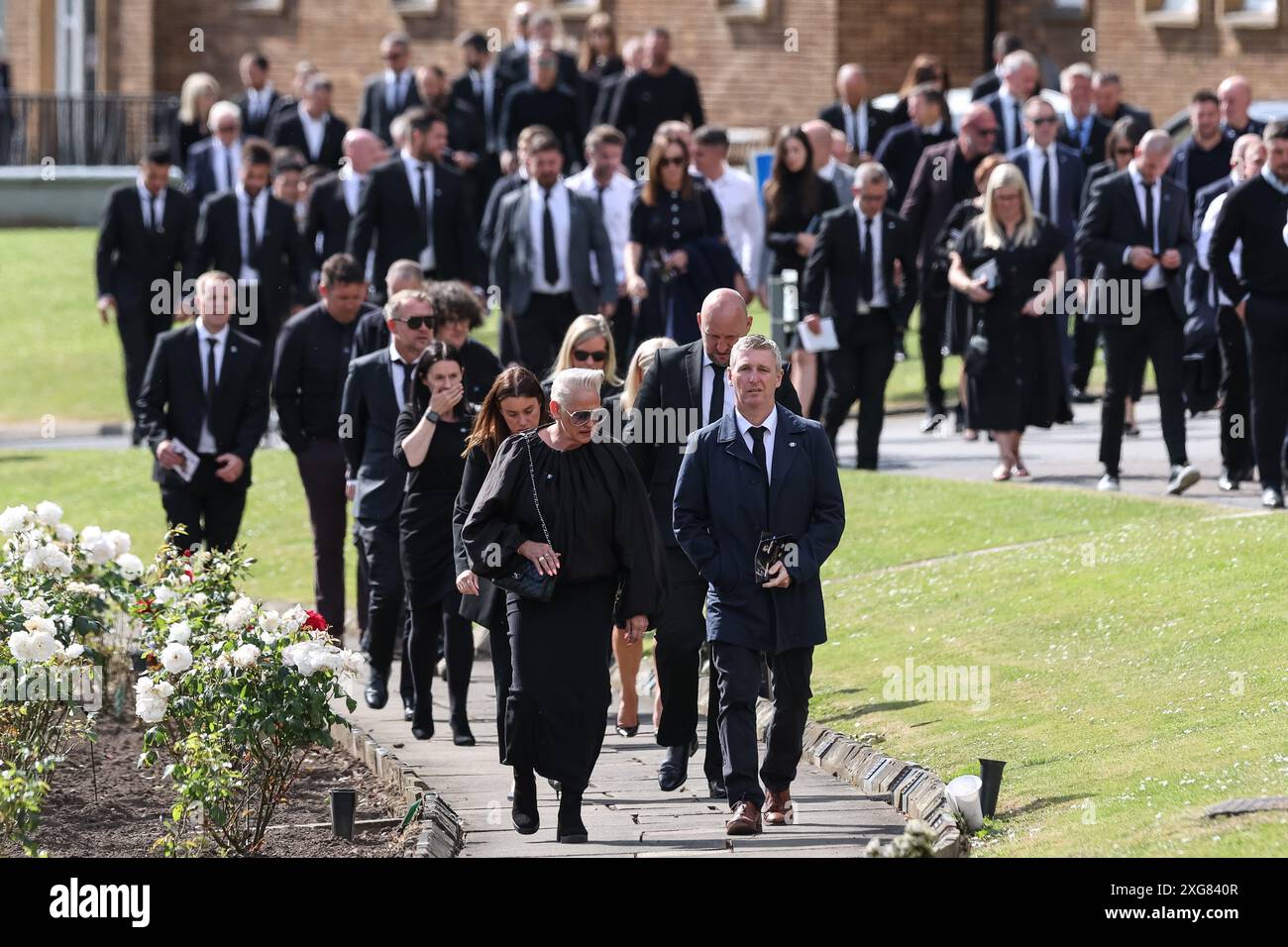 Mourners leave the chapel at Pontefract Crematorium after Rob CBE ...
