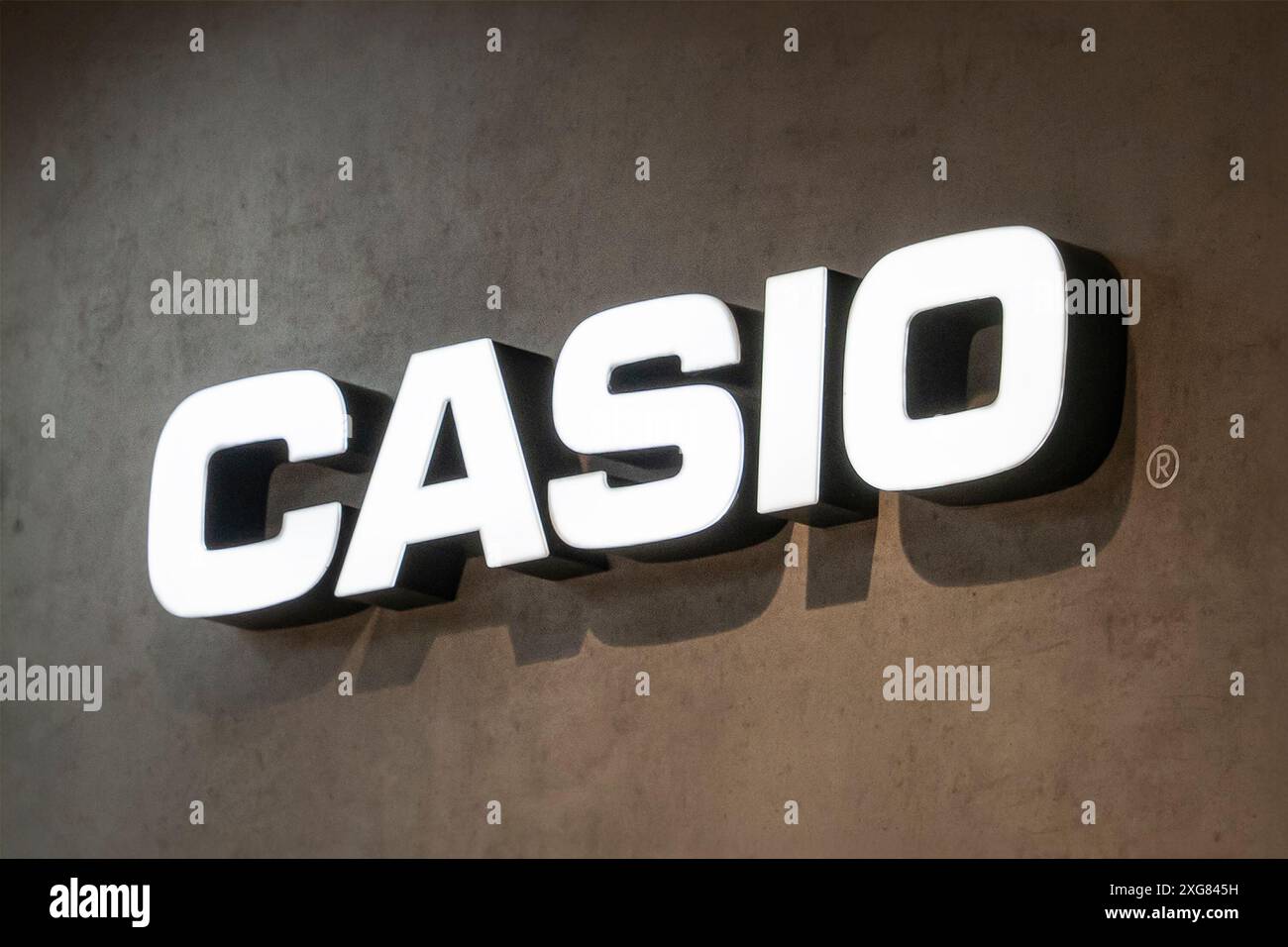 A highquality image features the CASIO logo glowing on a wall ...