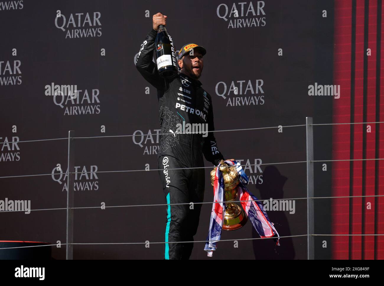 Mercedes driver Lewis Hamilton celebrates on the Podium after winning ...