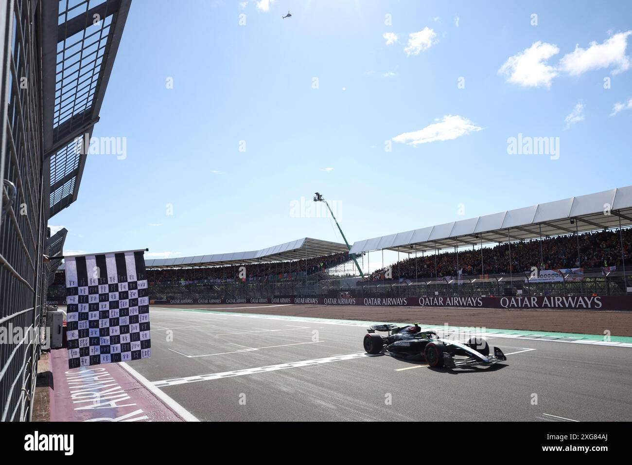Mercedes driver Lewis Hamilton of Britain crosses the finish line to ...