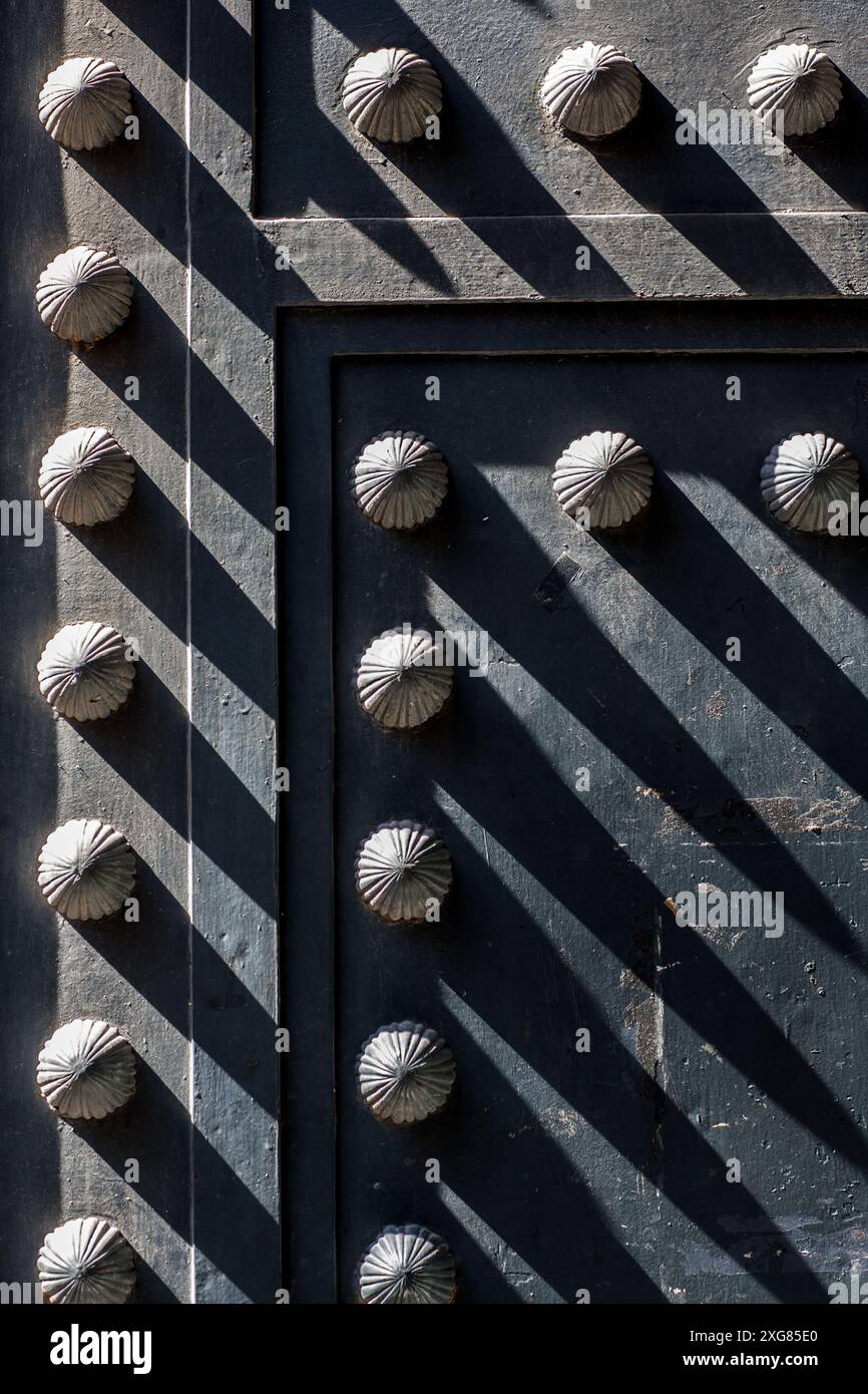 Close up of decorative studs on an iron door of a historic church in ...