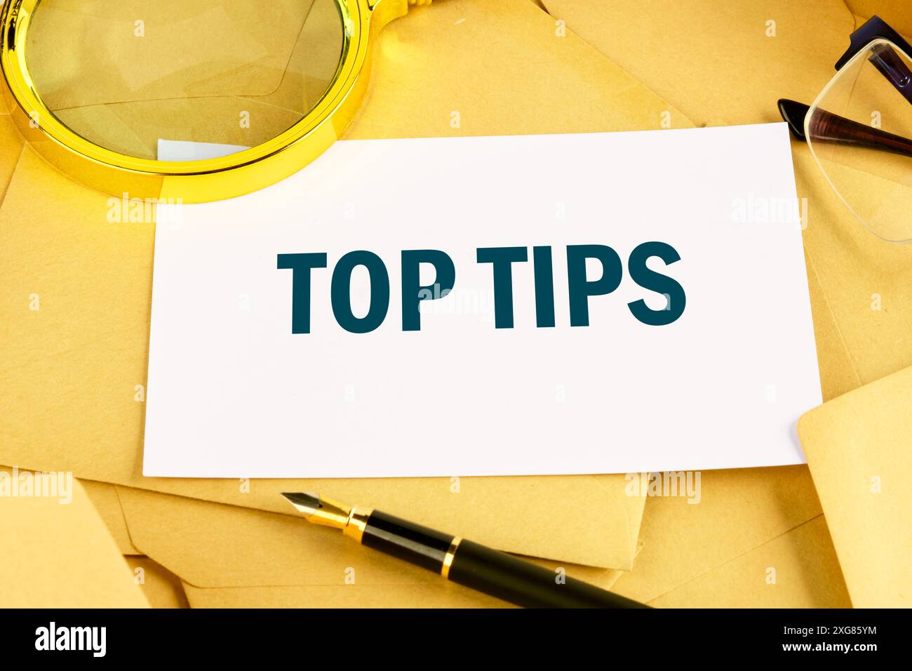 top tips word. text concept symbol TOP TIPS on a white business card ...