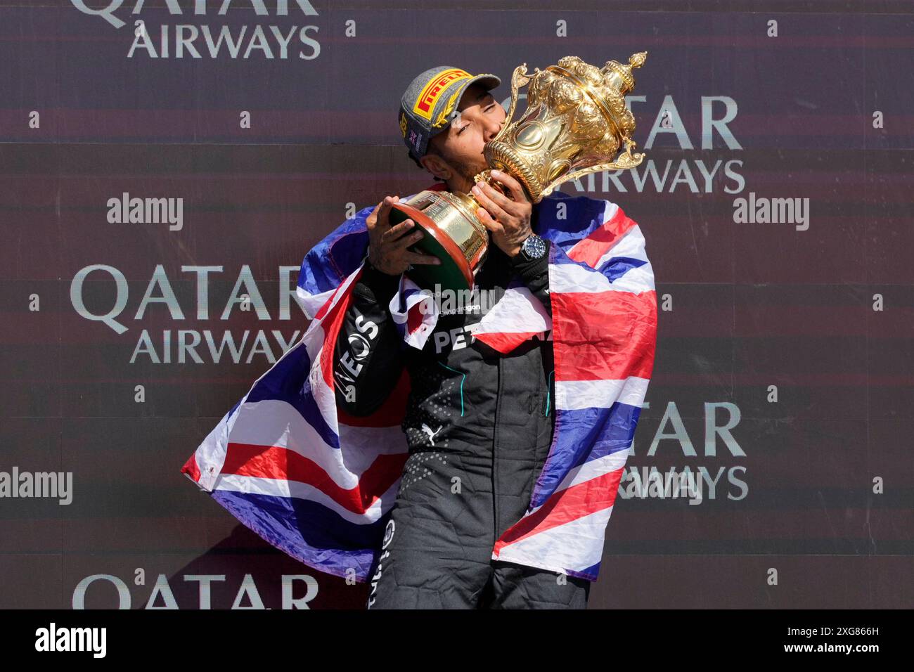 Mercedes driver Lewis Hamilton of Britain celebrates on the podium ...