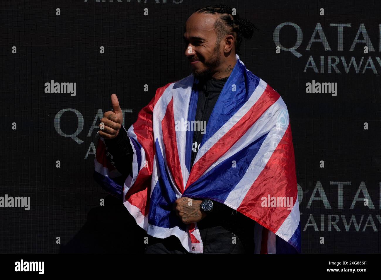 Mercedes driver Lewis Hamilton of Britain celebrates on the podium ...