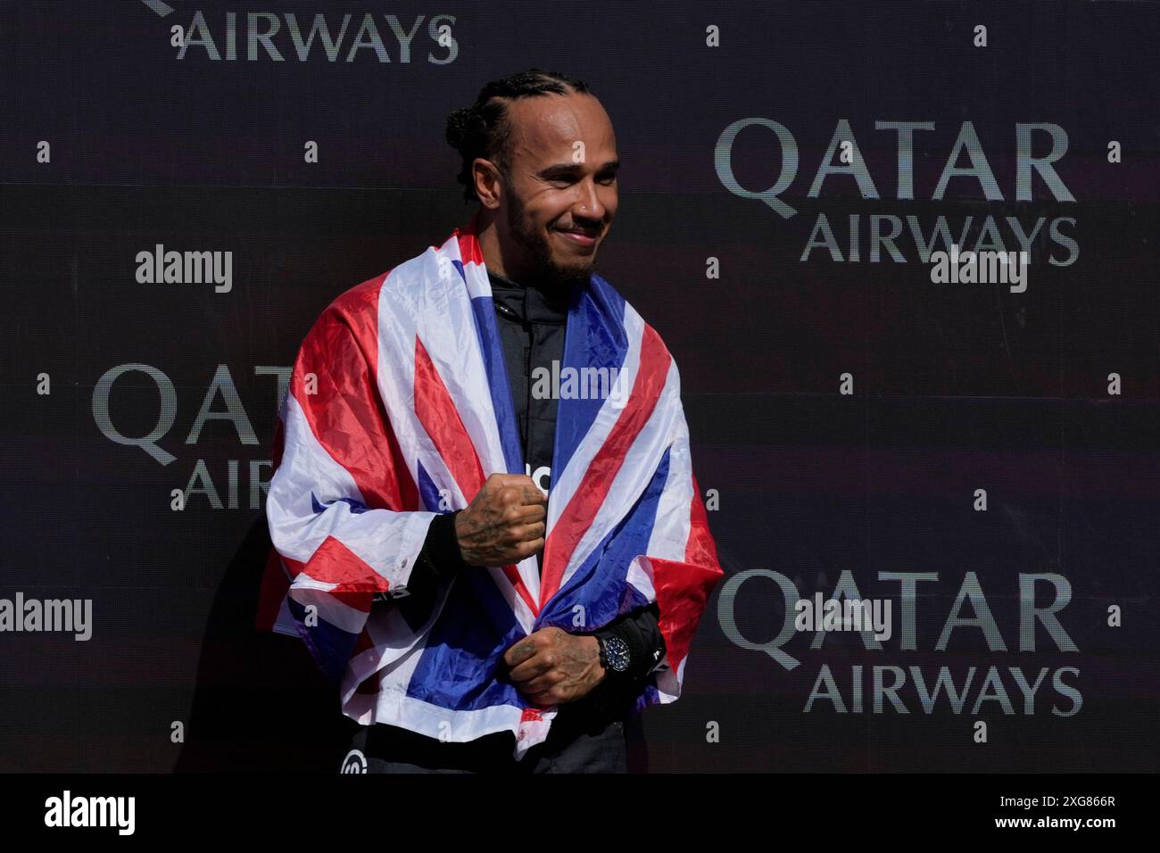 Mercedes driver Lewis Hamilton of Britain celebrates on the podium ...