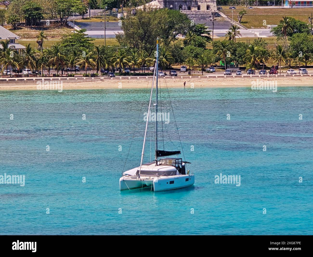 Lone catamaran moored along shallow waters in the Bahamas as viewed ...