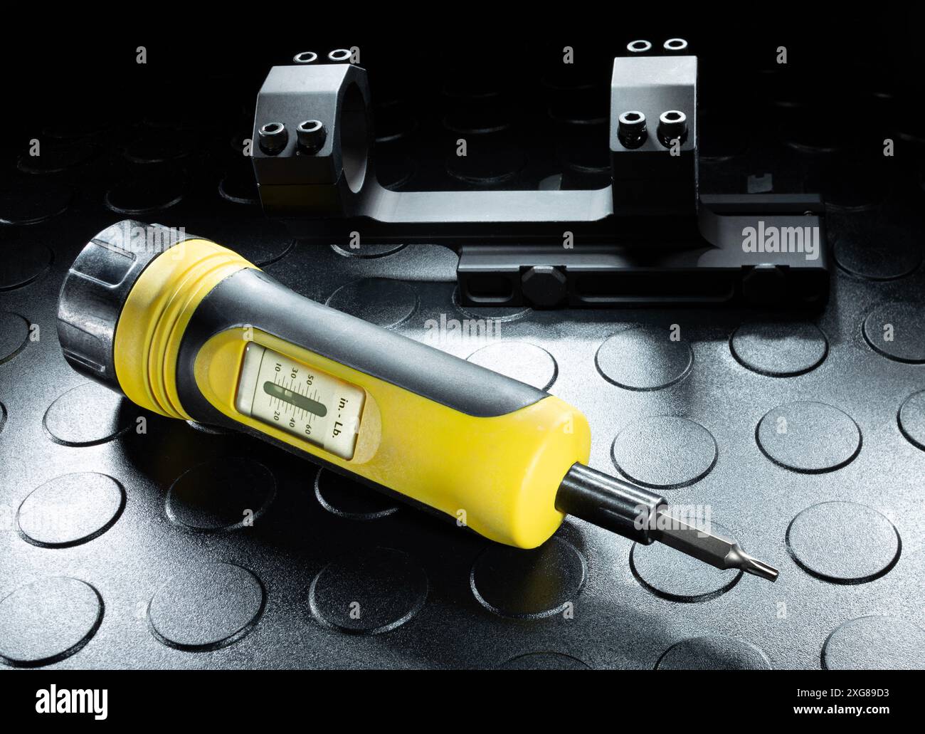 Torque tool that measures in inch pounds next to a large base for ...