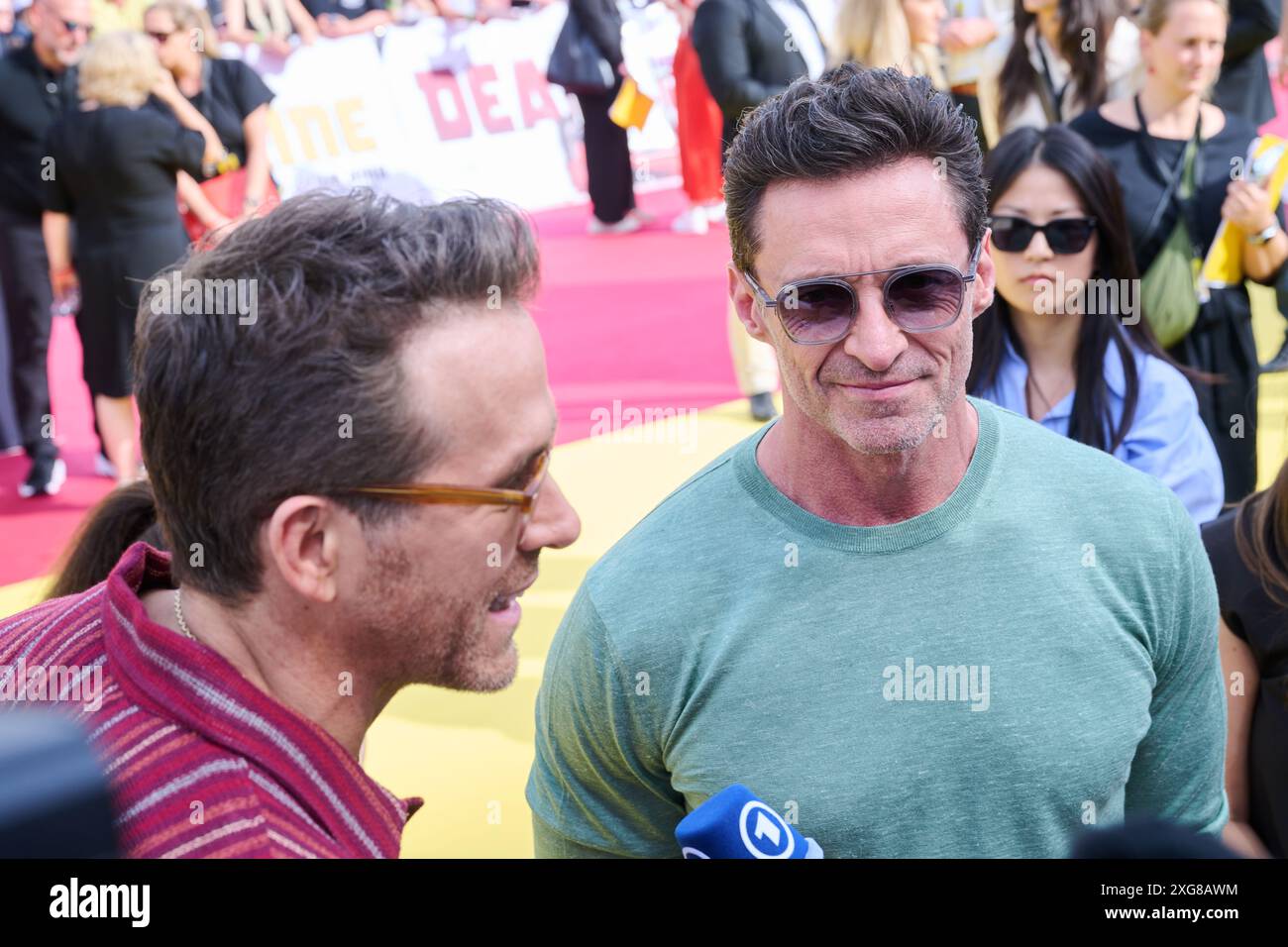 Berlin, Germany. 07th July, 2024. Actors Ryan Reynolds (l) and Hugh ...