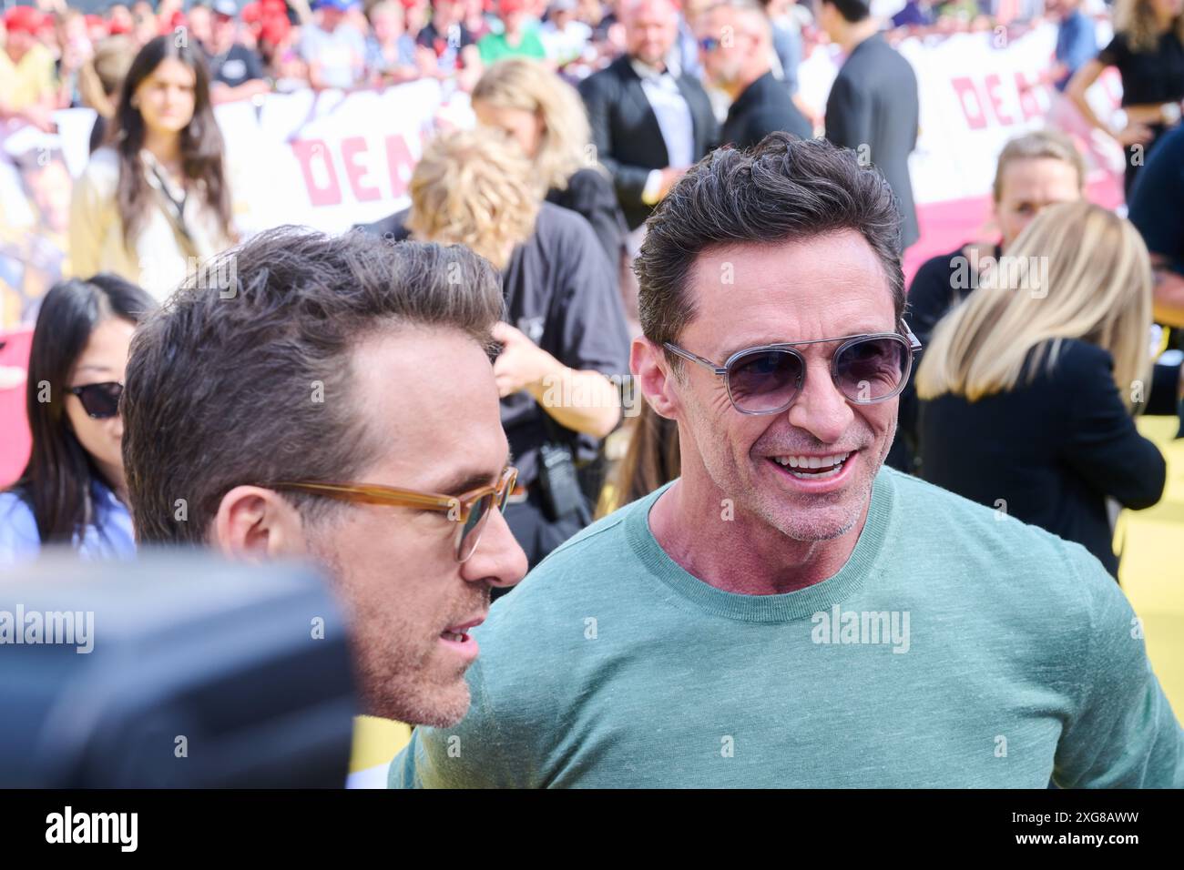 Berlin, Germany. 07th July, 2024. Actors Ryan Reynolds (l) and Hugh ...