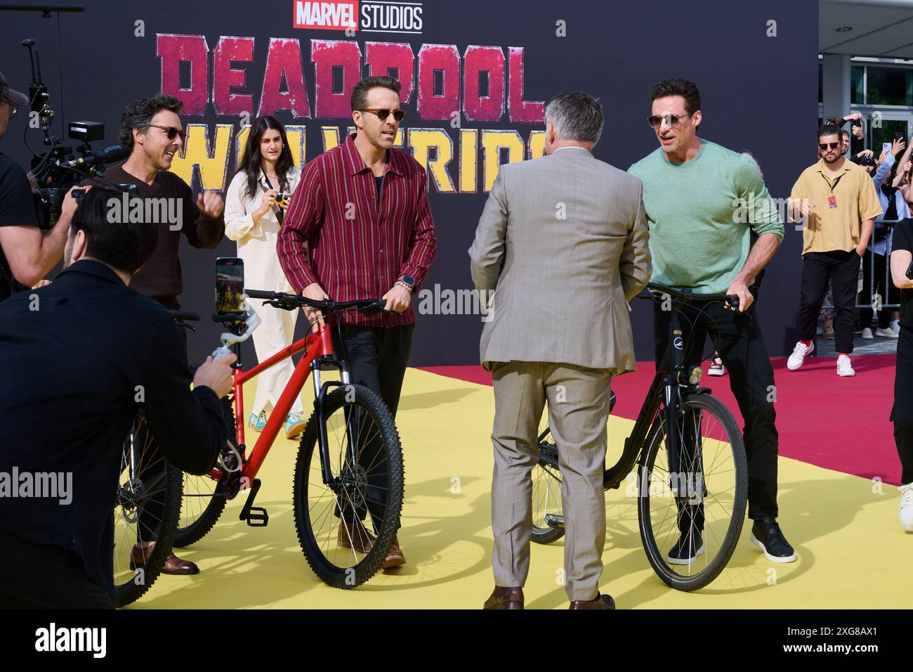 07 July 2024, Berlin: Producer Shawn Levy (l-r) and actors Ryan ...